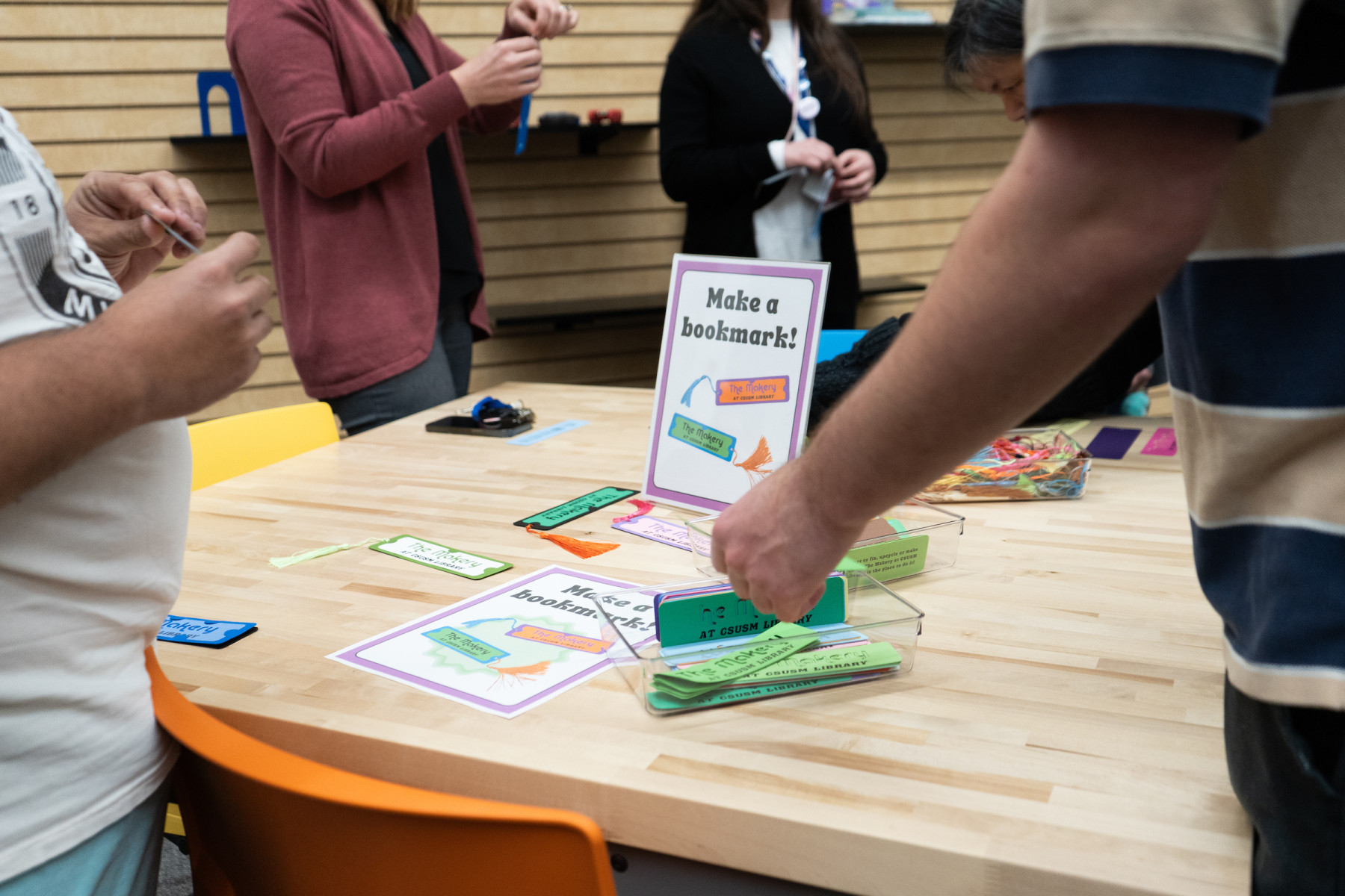 Students at the bookmark station on the opening day of The Makery ...