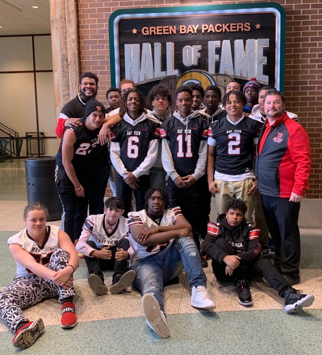 Milwaukee Bay View HS players and coaches outside Packer Hall of Fame