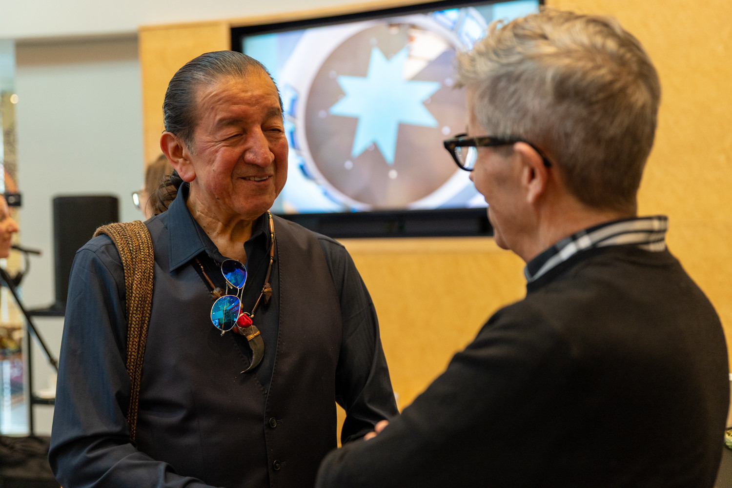 Artist Phillip Cote talking with guest