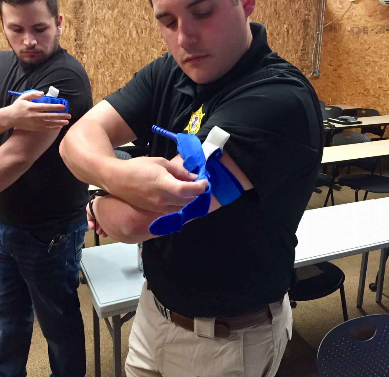 Practicing wrapping tourniquet on arm