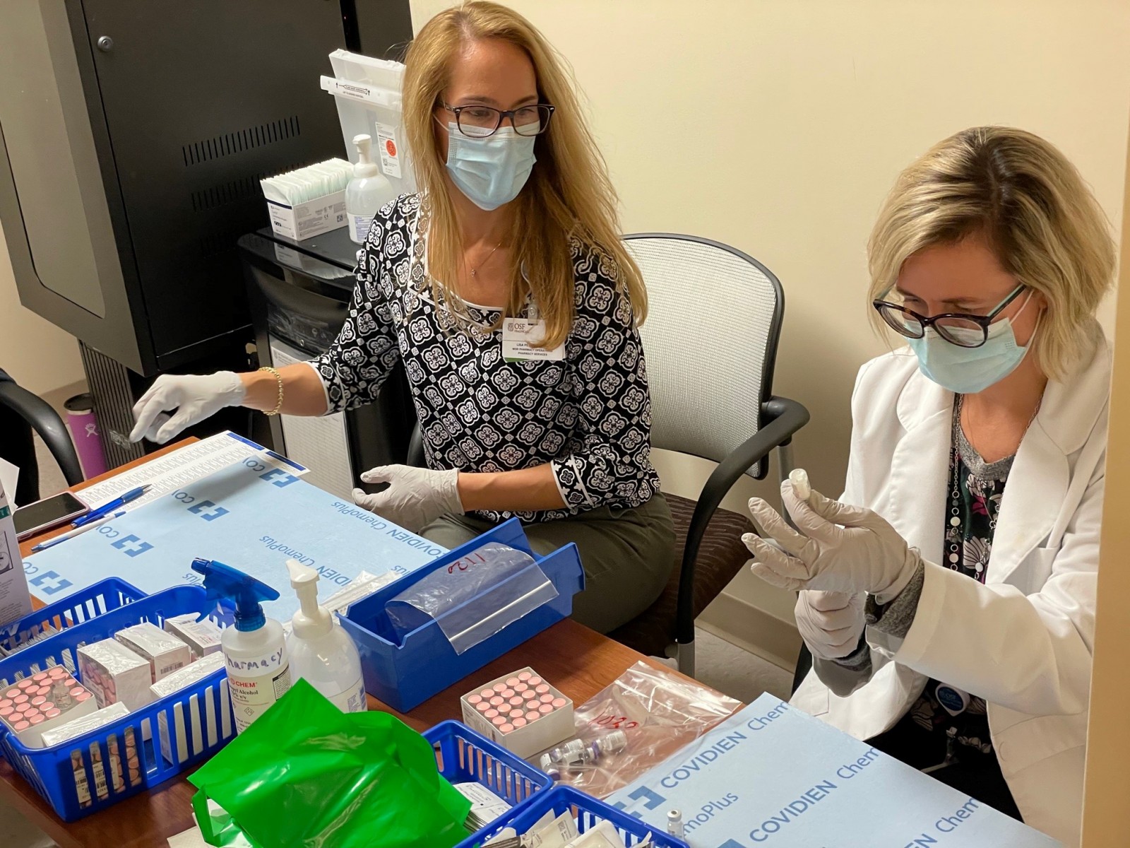 Pharmacists prepare vaccine