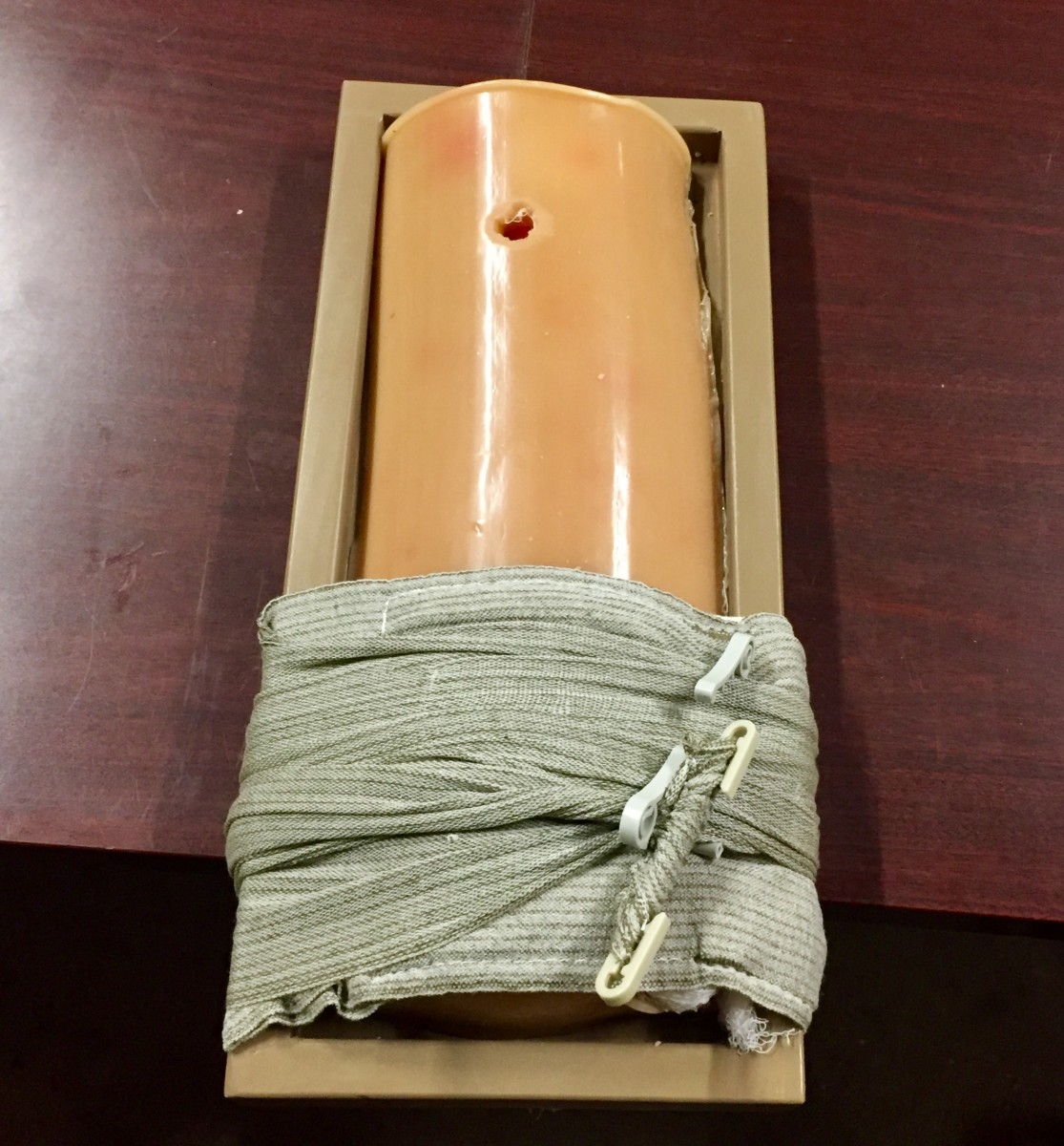 Wound practice device wrapped