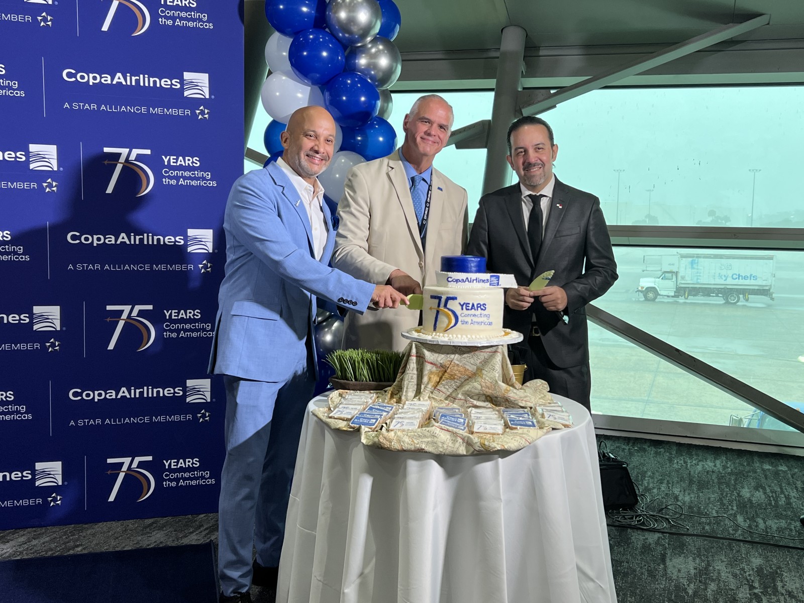 MDAD Director Ralph Cutie (second) & CEO cut cake with Copa executives