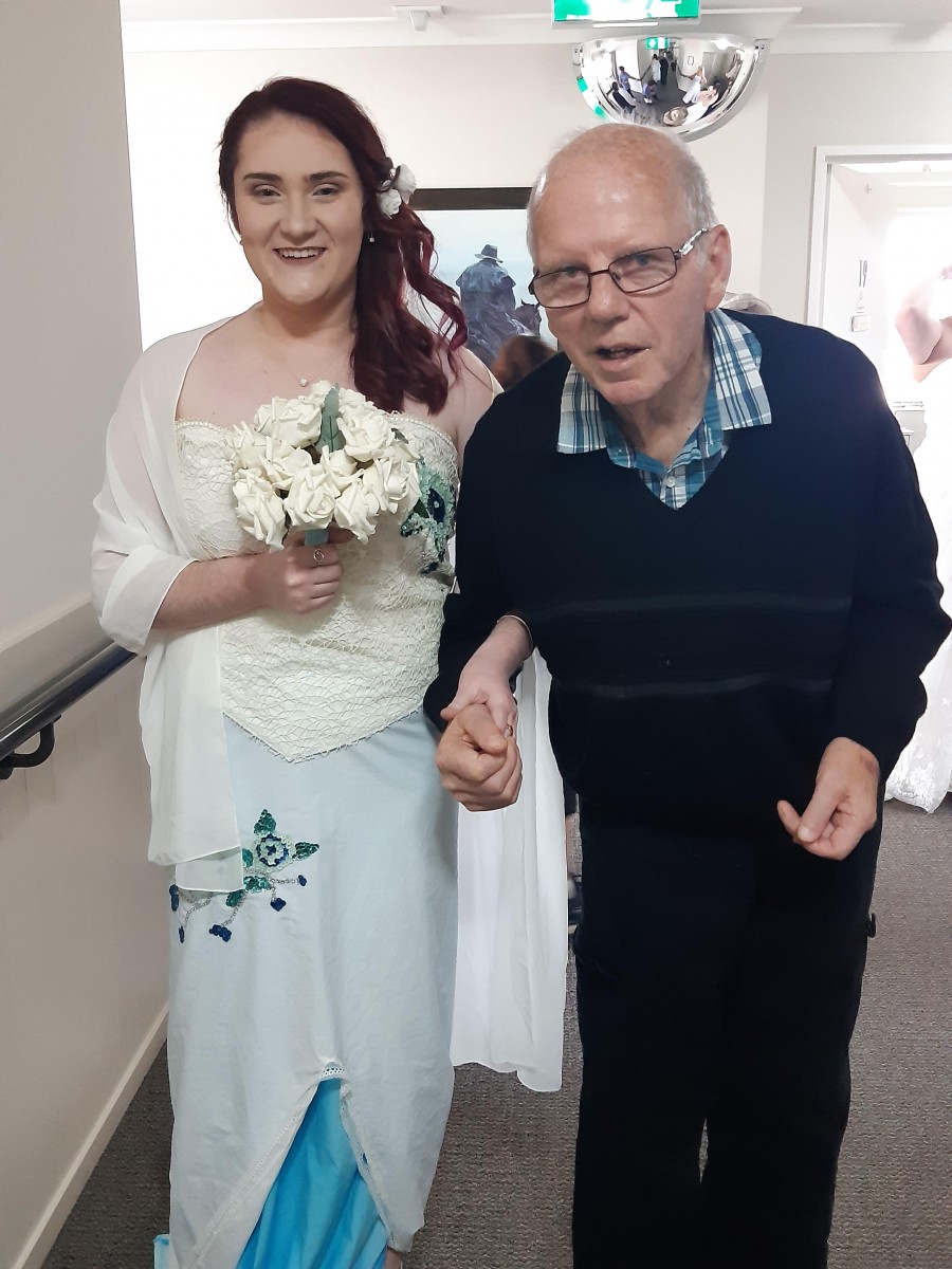 Caregiver Maddie Brown with resident Dusty (Allan) Miller