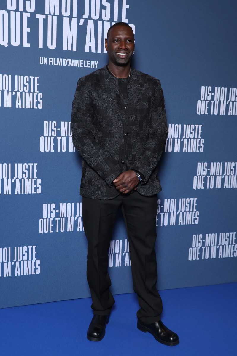 OMAR SY ATTENDS THE PREMIERE OF "DIS-MOI JUSTE QUE TU M'AIMES" WEARING ...