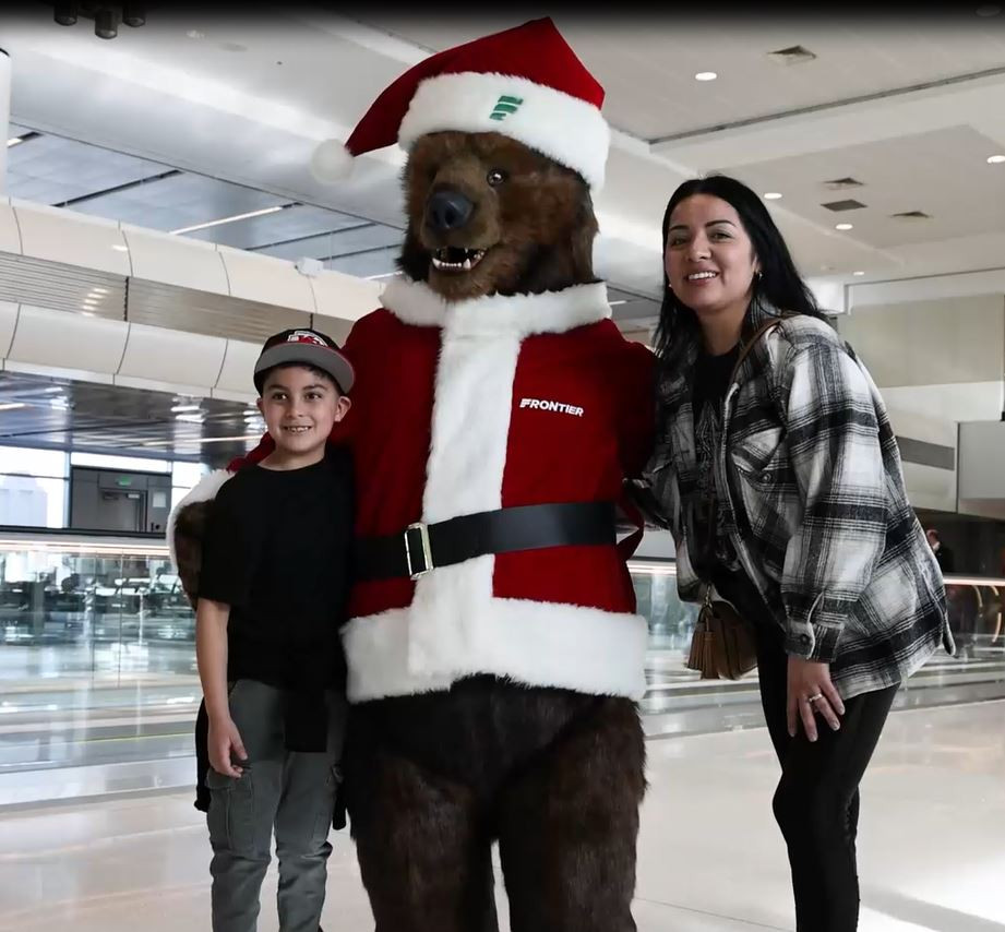 Frontier's Griz the "Santa Bear" Surprises Children with Gifts