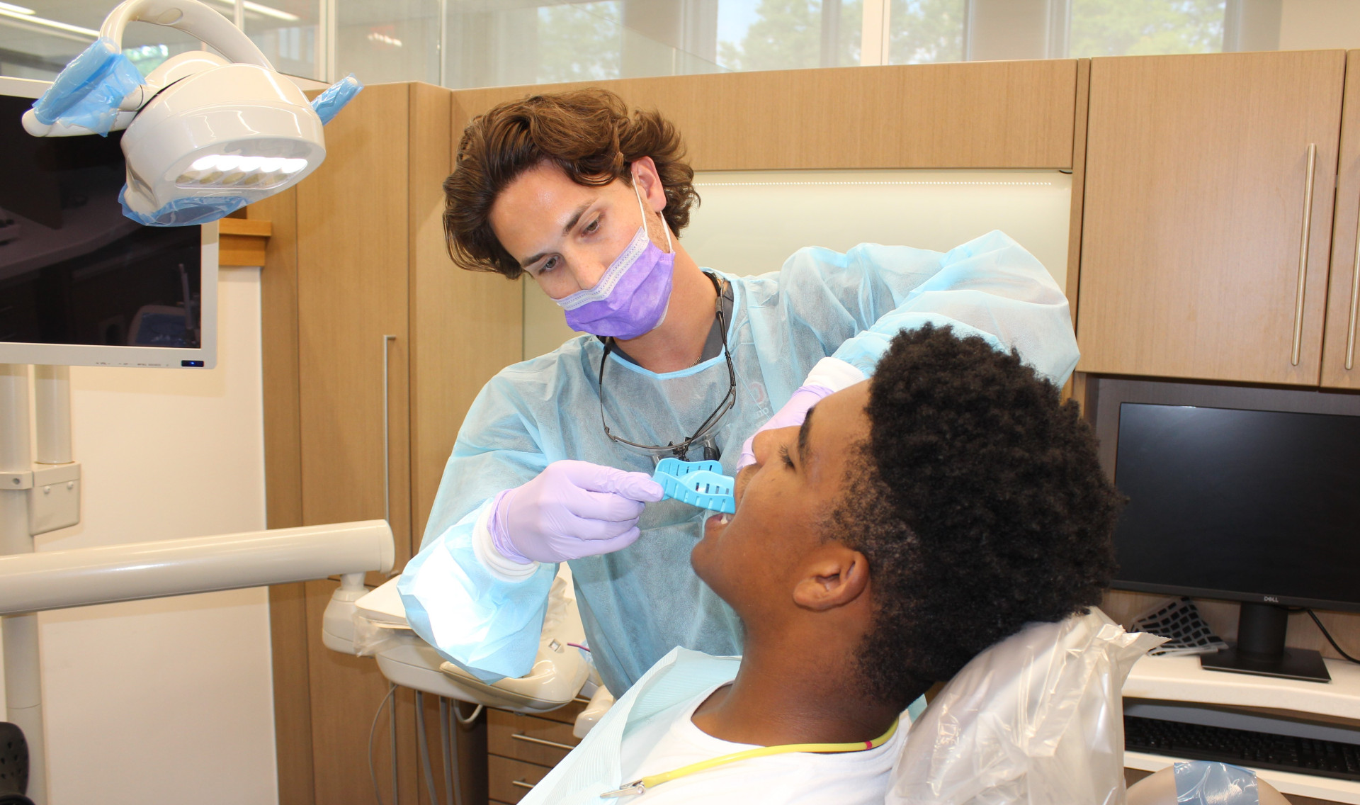 Dental students make free mouthguards for local students