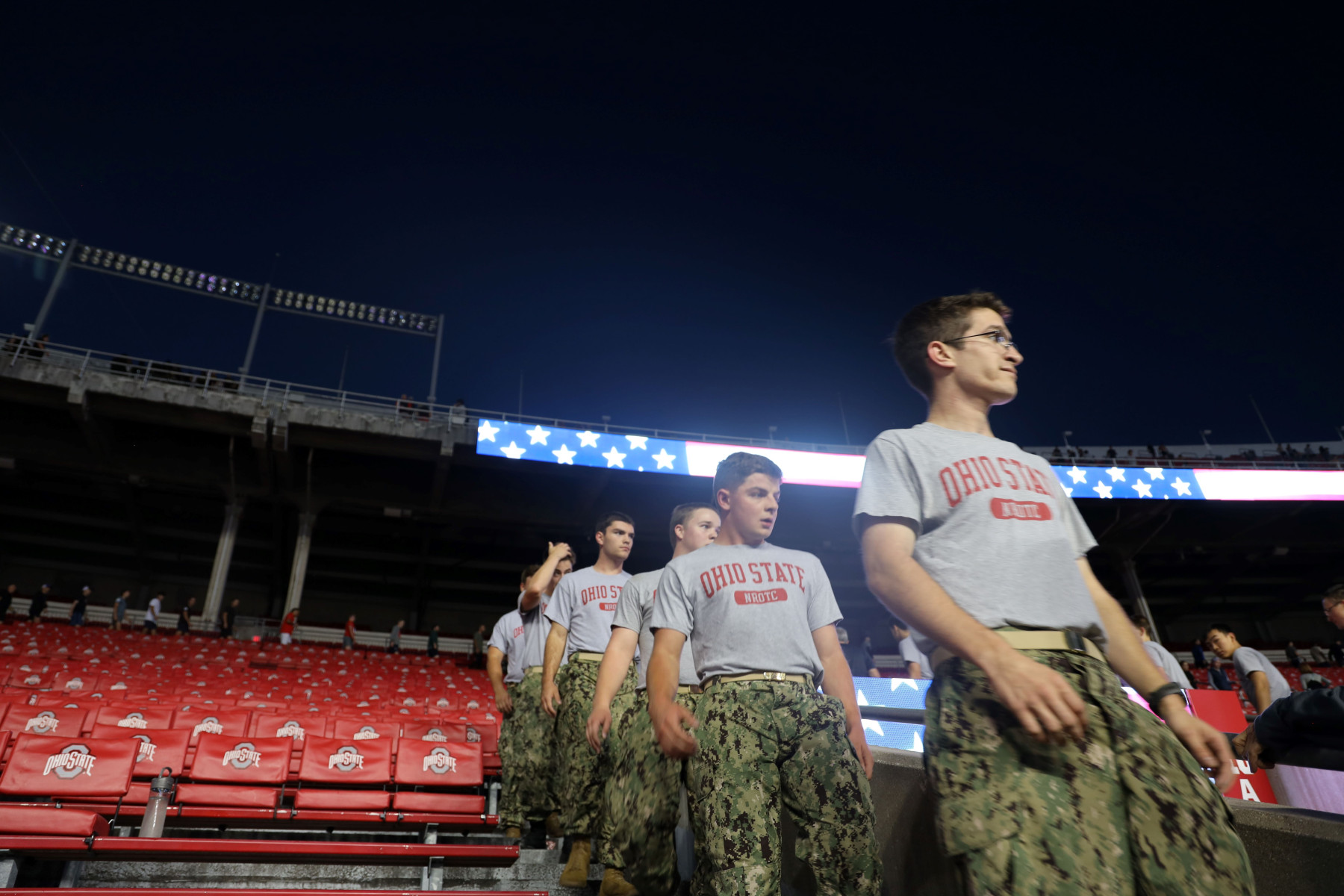 Navy ROTC members march down the stairs to Ohio Stadium
