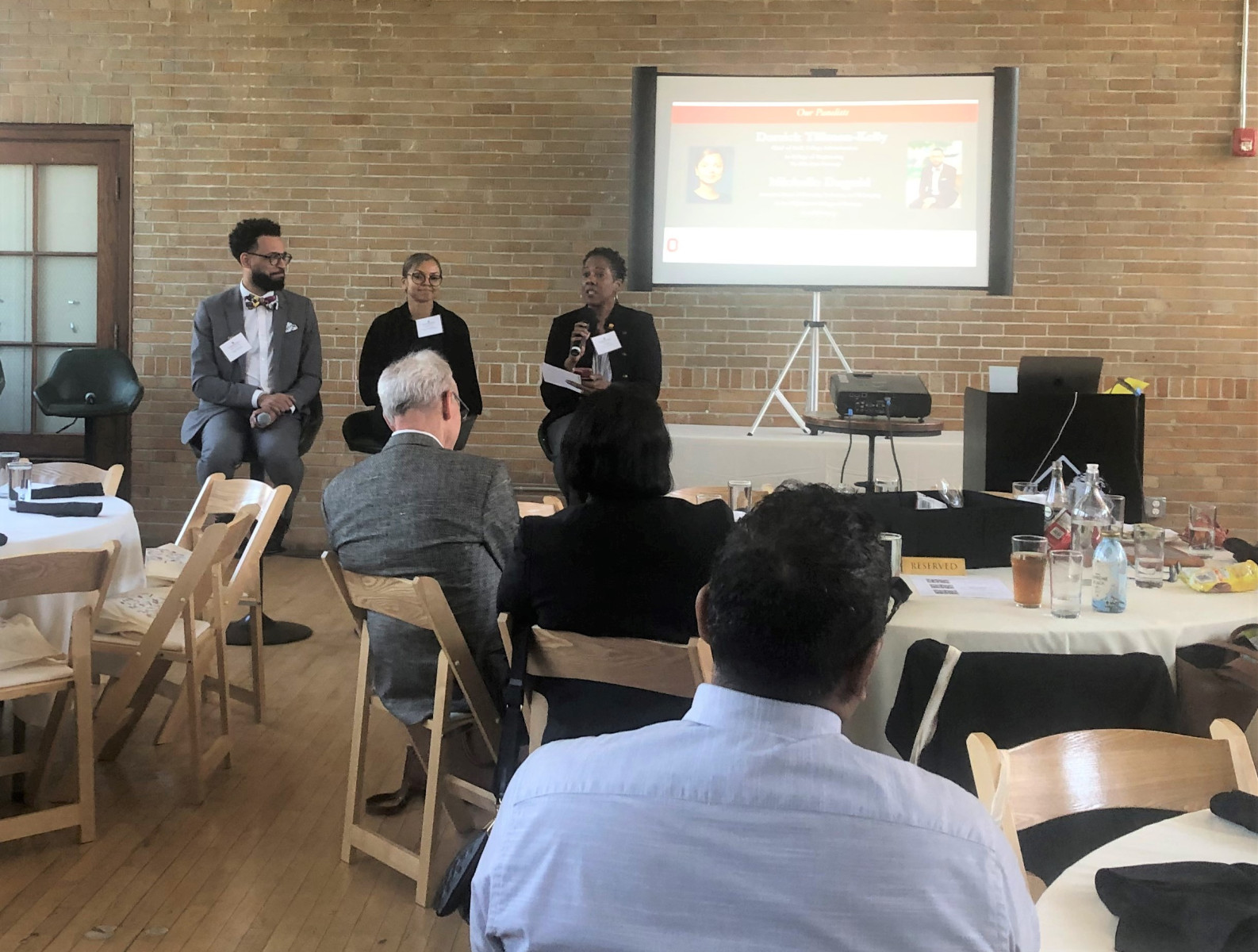 A panel discussion featured Ohio State's Derrick Tillman-Kelly (left0 ...