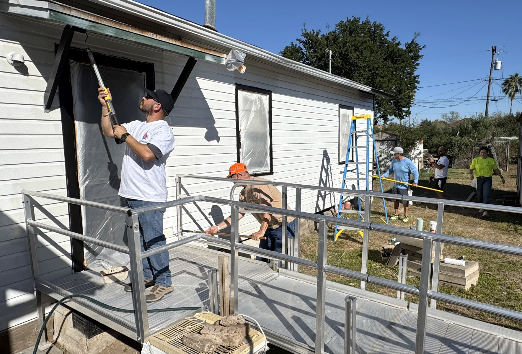 STC Construction students honor veteran with annual community paint project