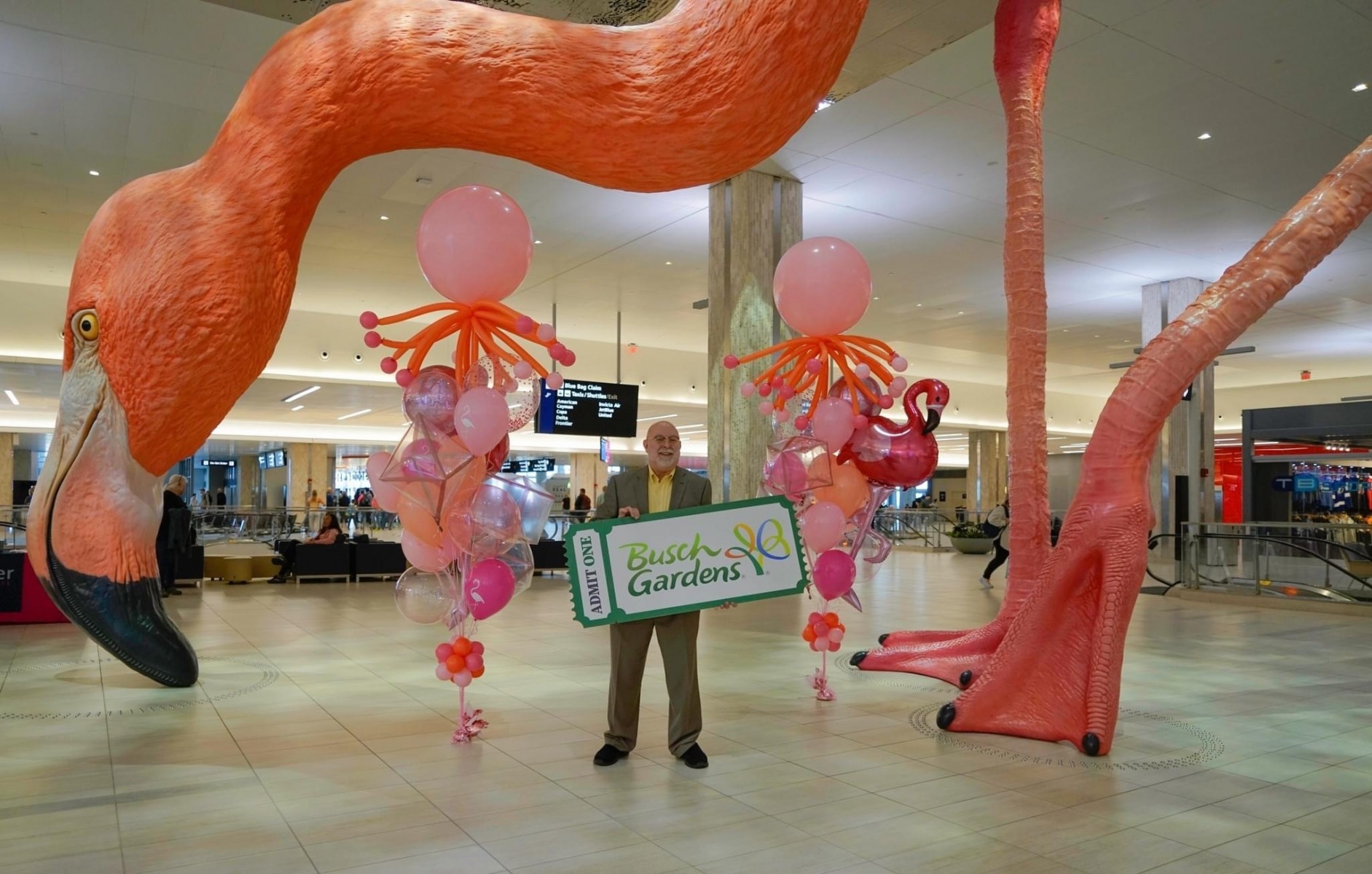Winner of TPA's Name the Flamingo contest visits TPA, collects prizes