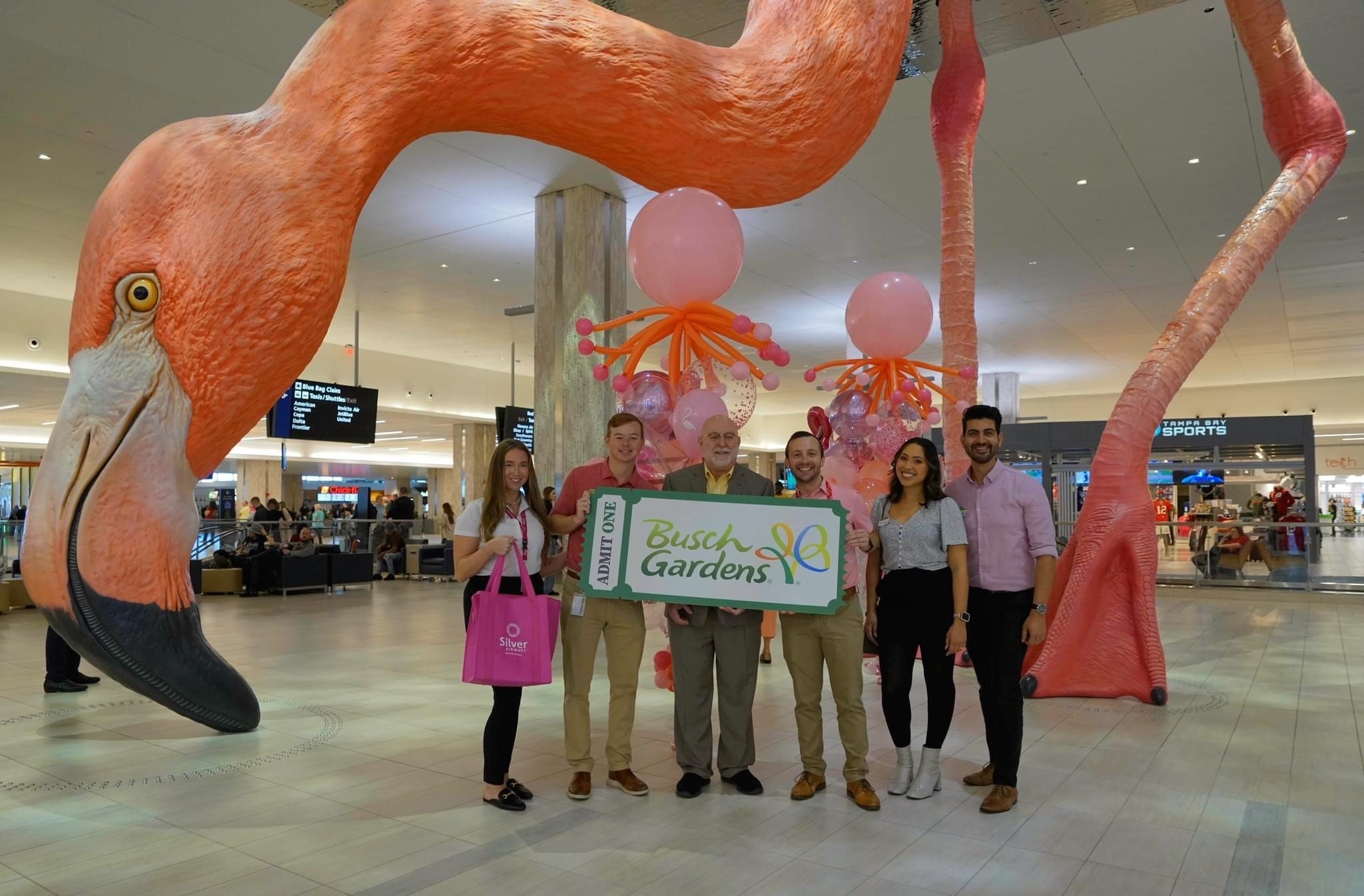 Winner of TPA's Name the Flamingo contest visits TPA, collects prizes