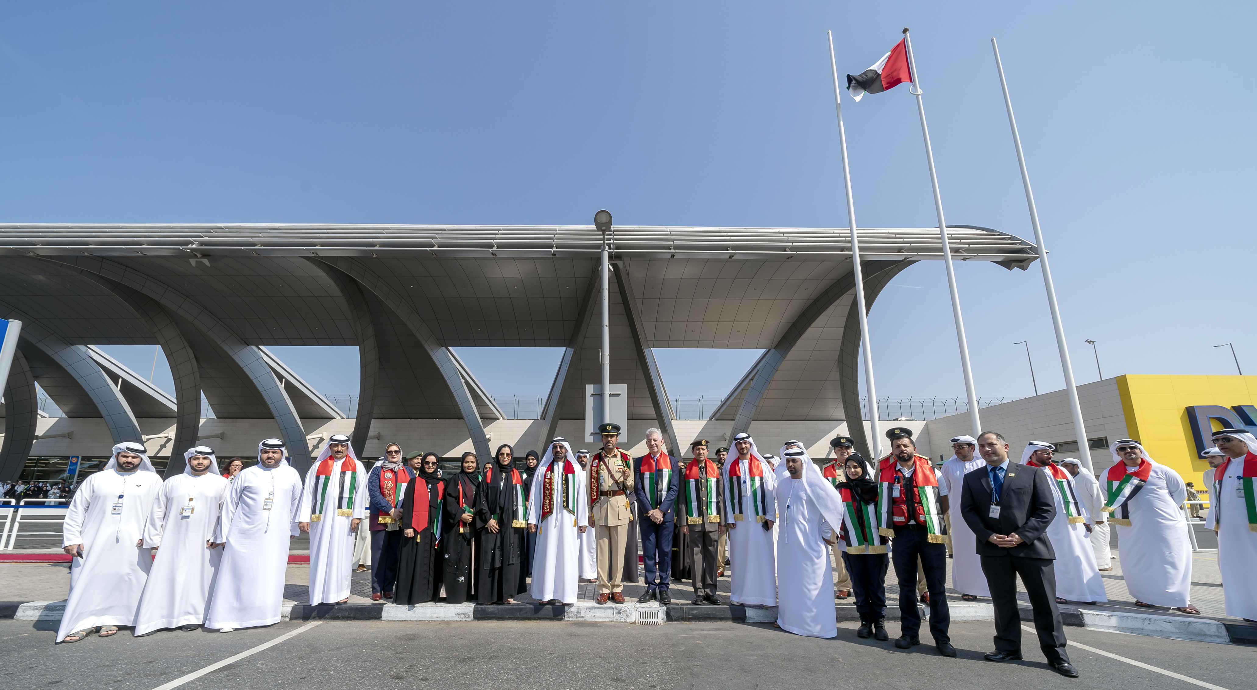 His Highness Sheikh Ahmed Bin Saeed Al Maktoum raises the UAE flag at DXB