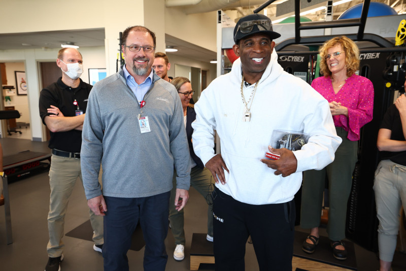 Coach Prime celebrates with fellow UCHealth patients